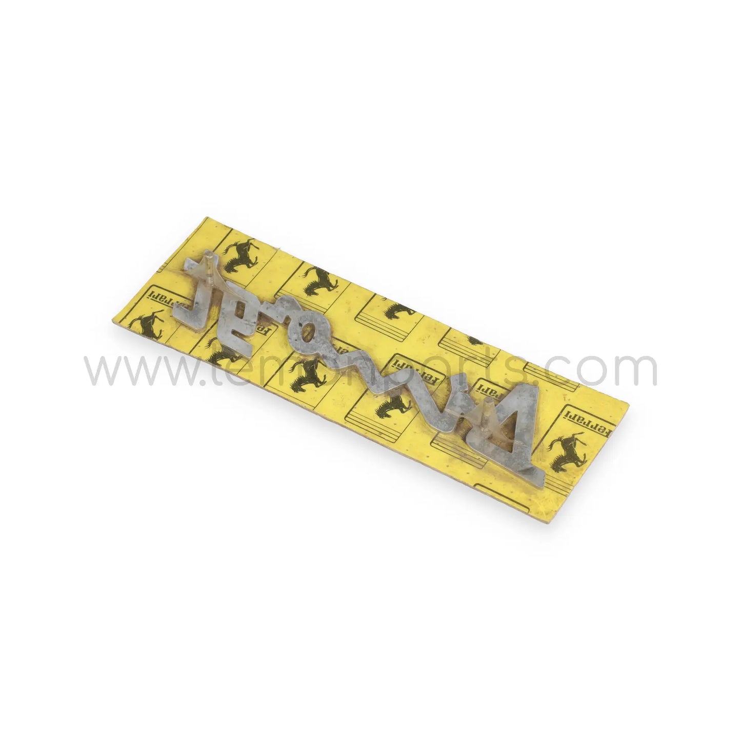 NOS Ferrari Dino GT script badge in original package for Ferrari Dino ...